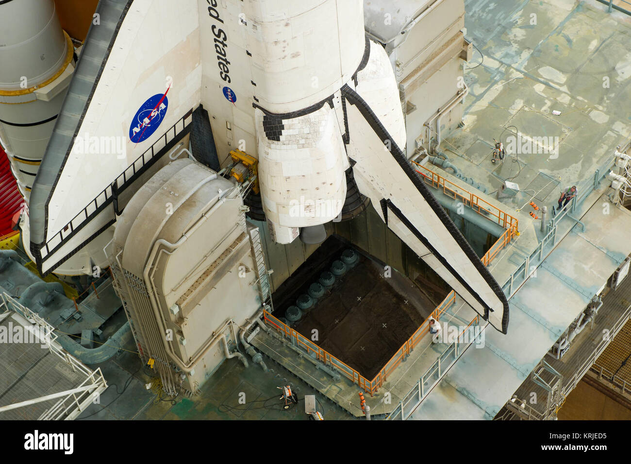 The space shuttle Atlantis is revealed as the rotating service ...