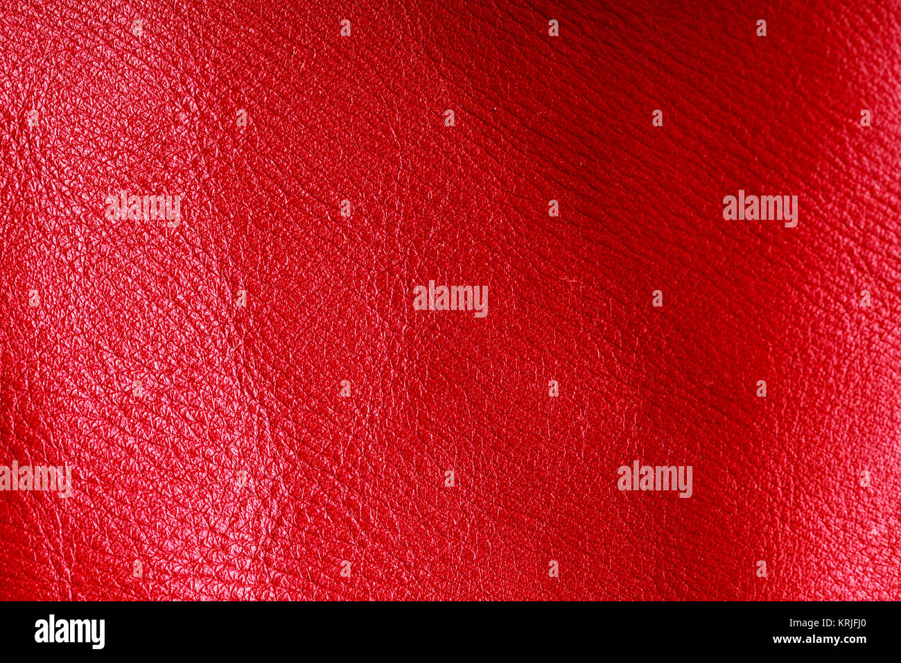 Red leather texture background closeup. Folds wavy natural skin ...