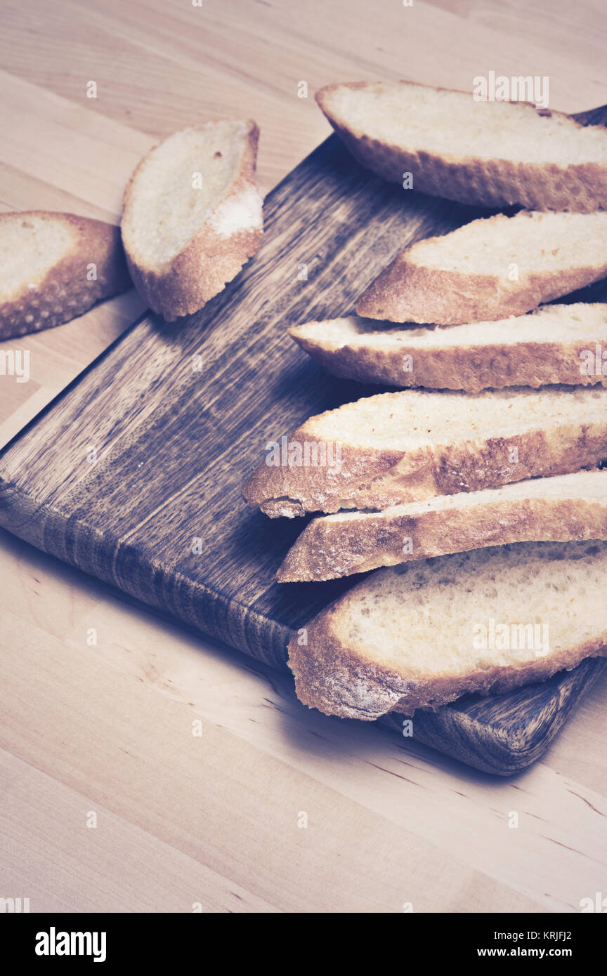 Bread on wooden plate hi-res stock photography and images - Alamy