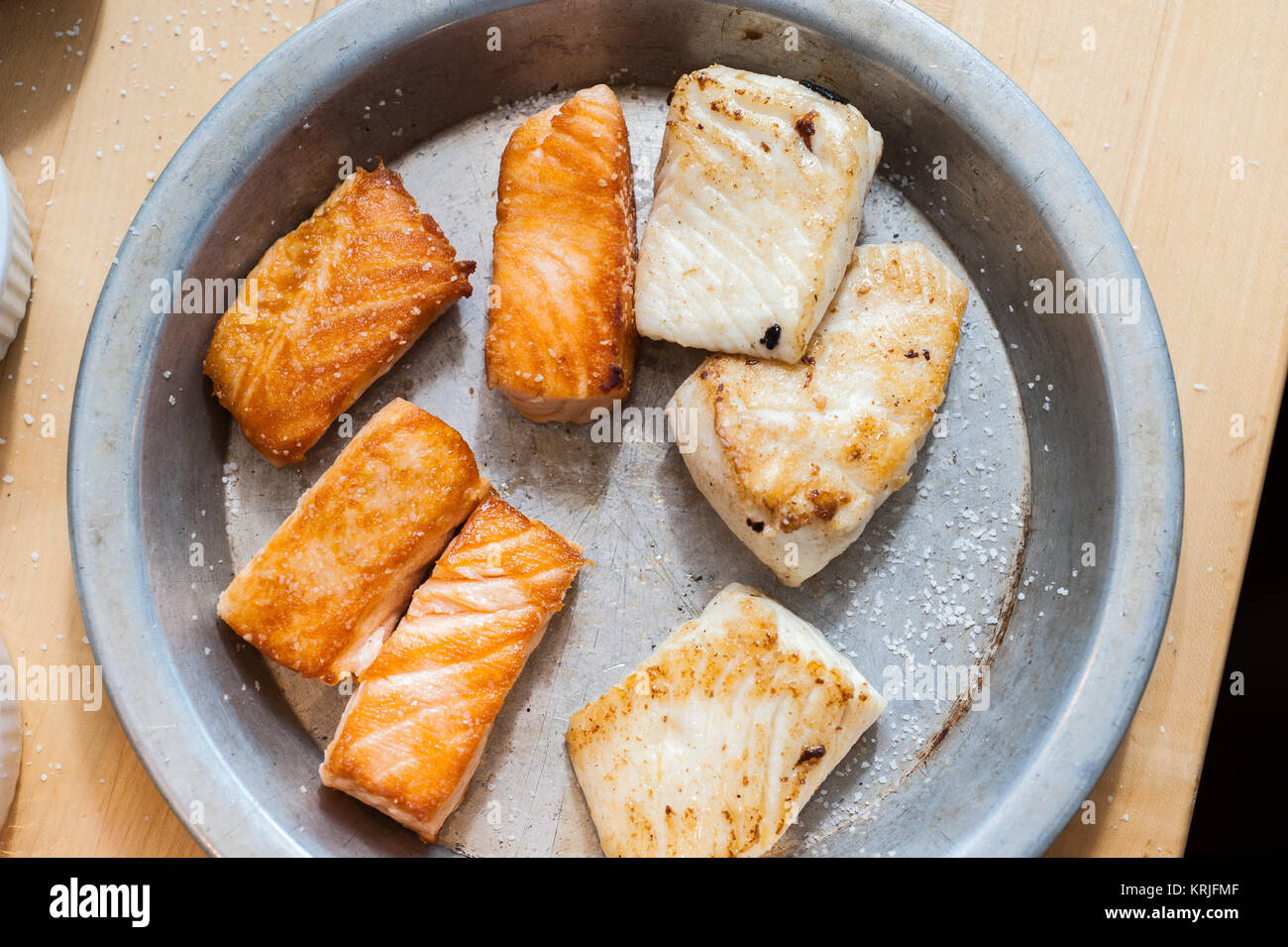 Cooked pieces of fish on a tray Stock Photo - Alamy