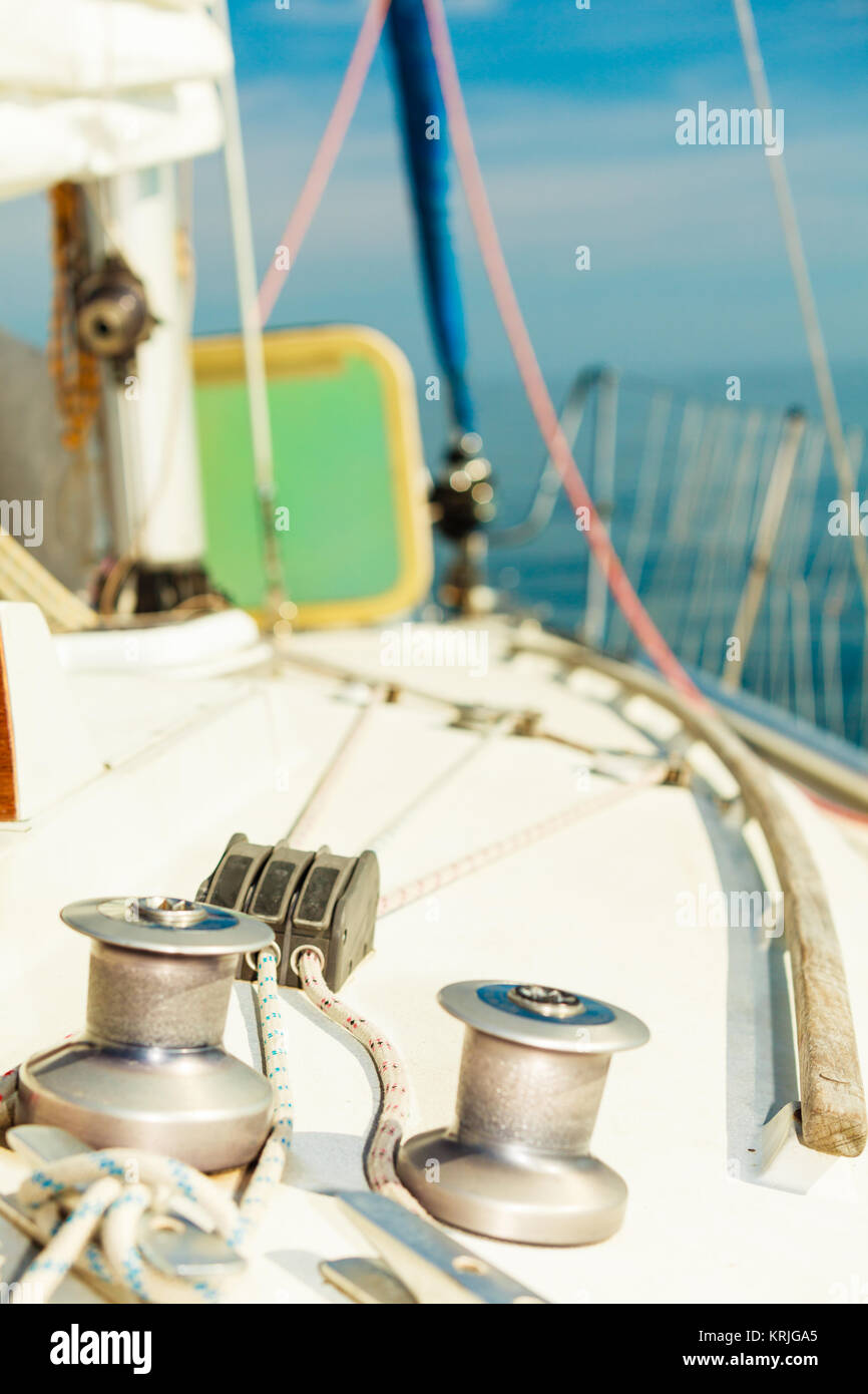 Yacht capstan with rope on sailing boat during cruise, marine objects ...