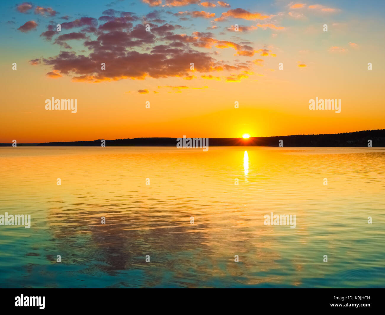 Sunset over the river Stock Photo - Alamy