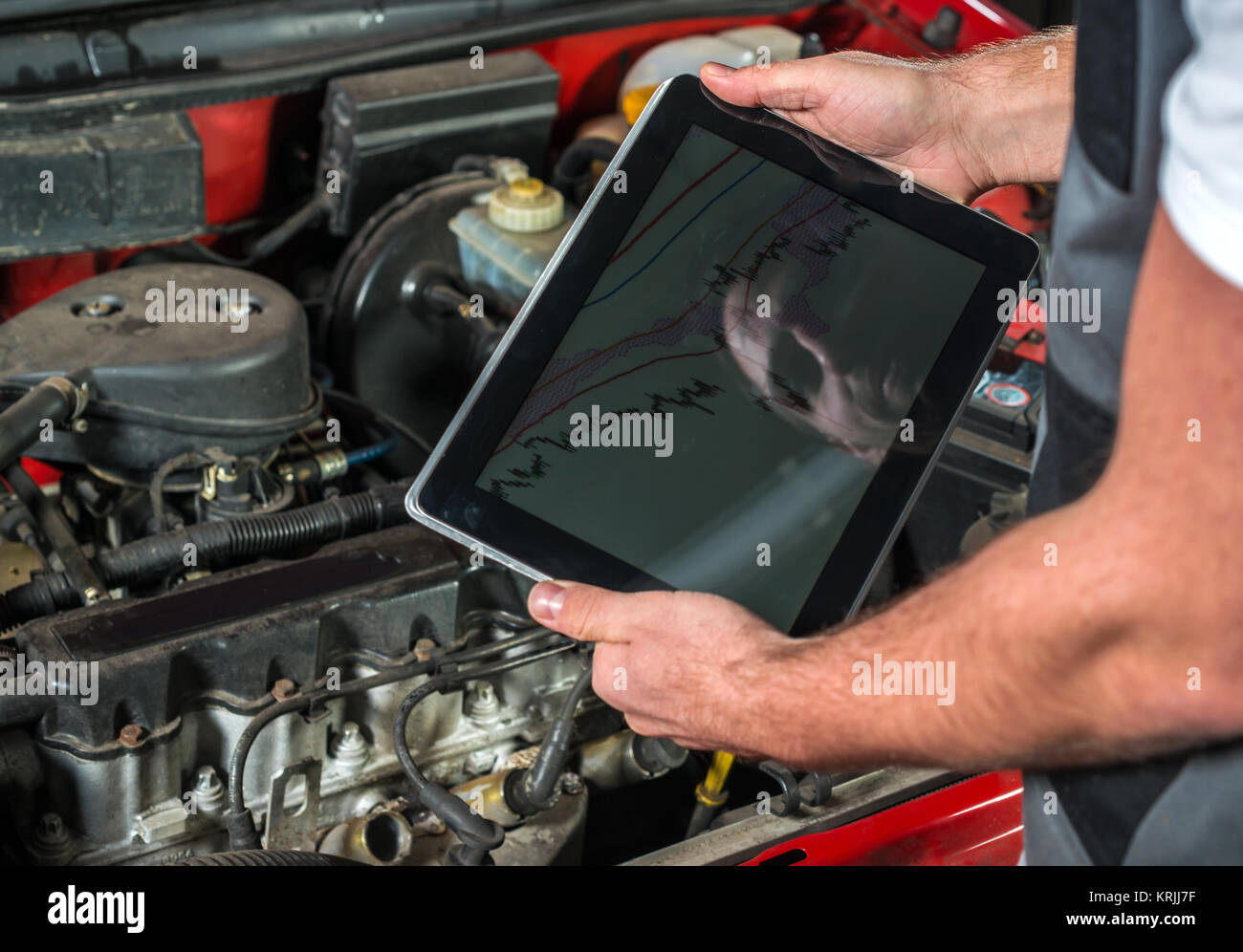 Mechanic tablet pc repairing car hi-res stock photography and images ...