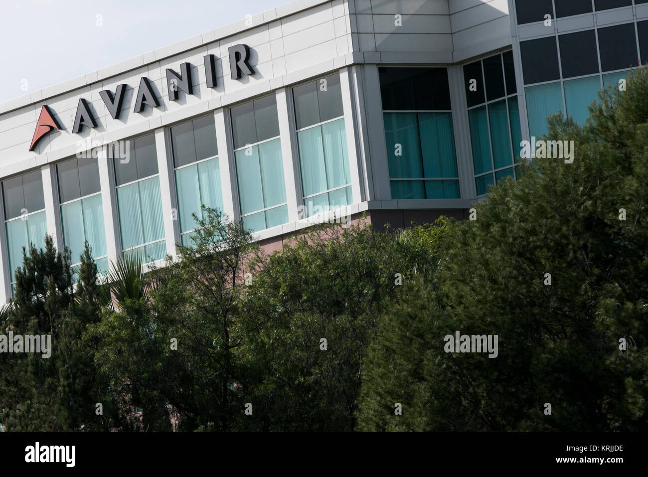 A logo sign outside of the headquarters of Avanir Pharmaceuticals, Inc ...