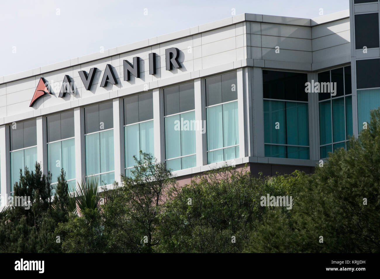 A logo sign outside of the headquarters of Avanir Pharmaceuticals, Inc., in Aliso Viejo ...