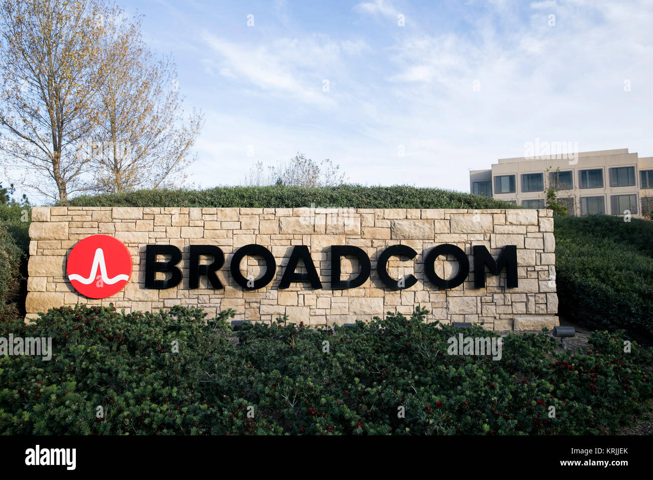A logo sign outside of the headquarters of the Broadcom Corporation in ...