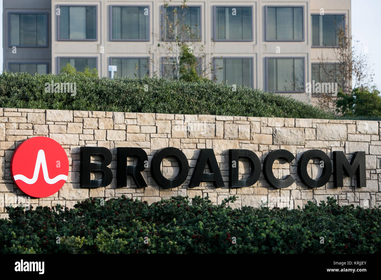 A logo sign outside of the headquarters of the Broadcom Corporation in ...