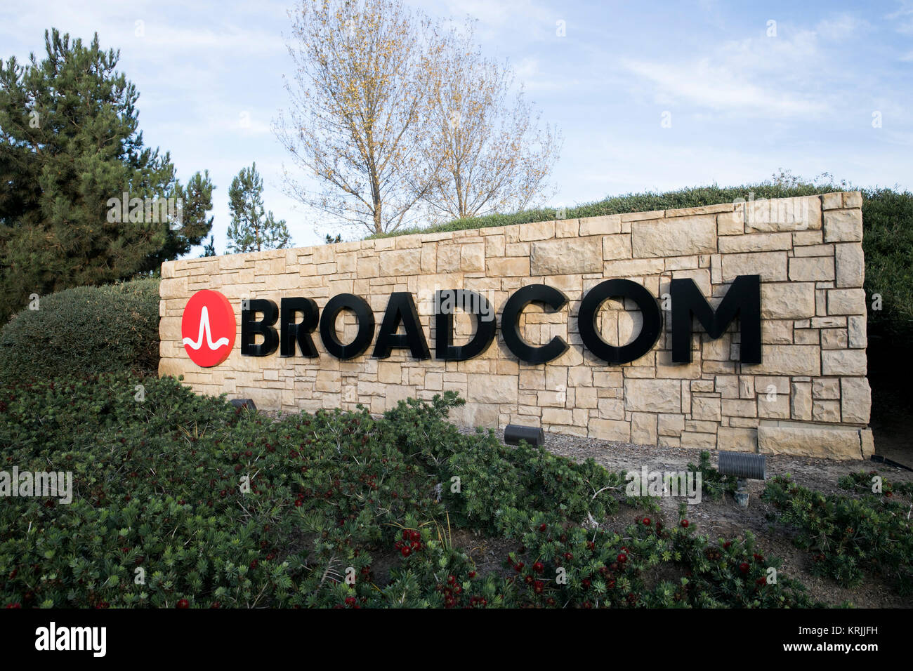 A logo sign outside of the headquarters of the Broadcom Corporation in ...