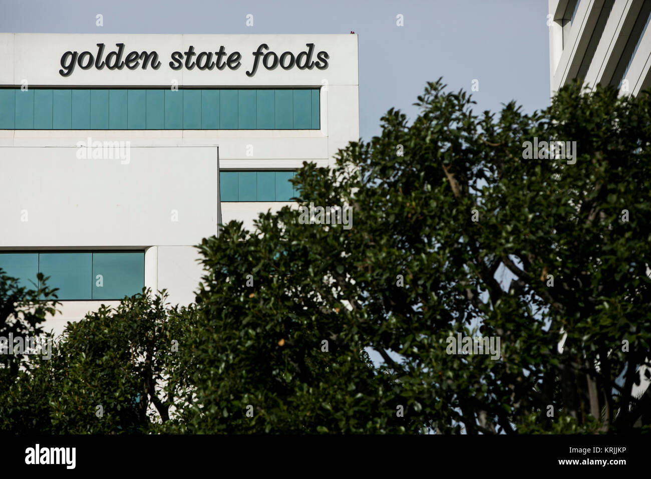 A logo sign outside of the headquarters of Golden State Foods in Irvine ...