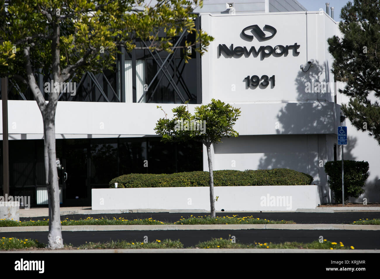 A logo sign outside of the headquarters of the Newport Corporation in ...