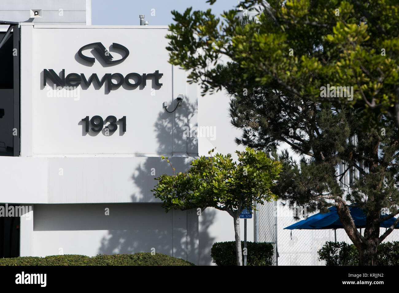 A logo sign outside of the headquarters of the Newport Corporation in ...