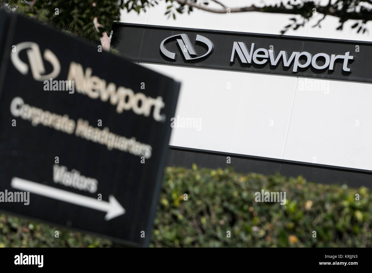 A logo sign outside of the headquarters of the Newport Corporation in ...