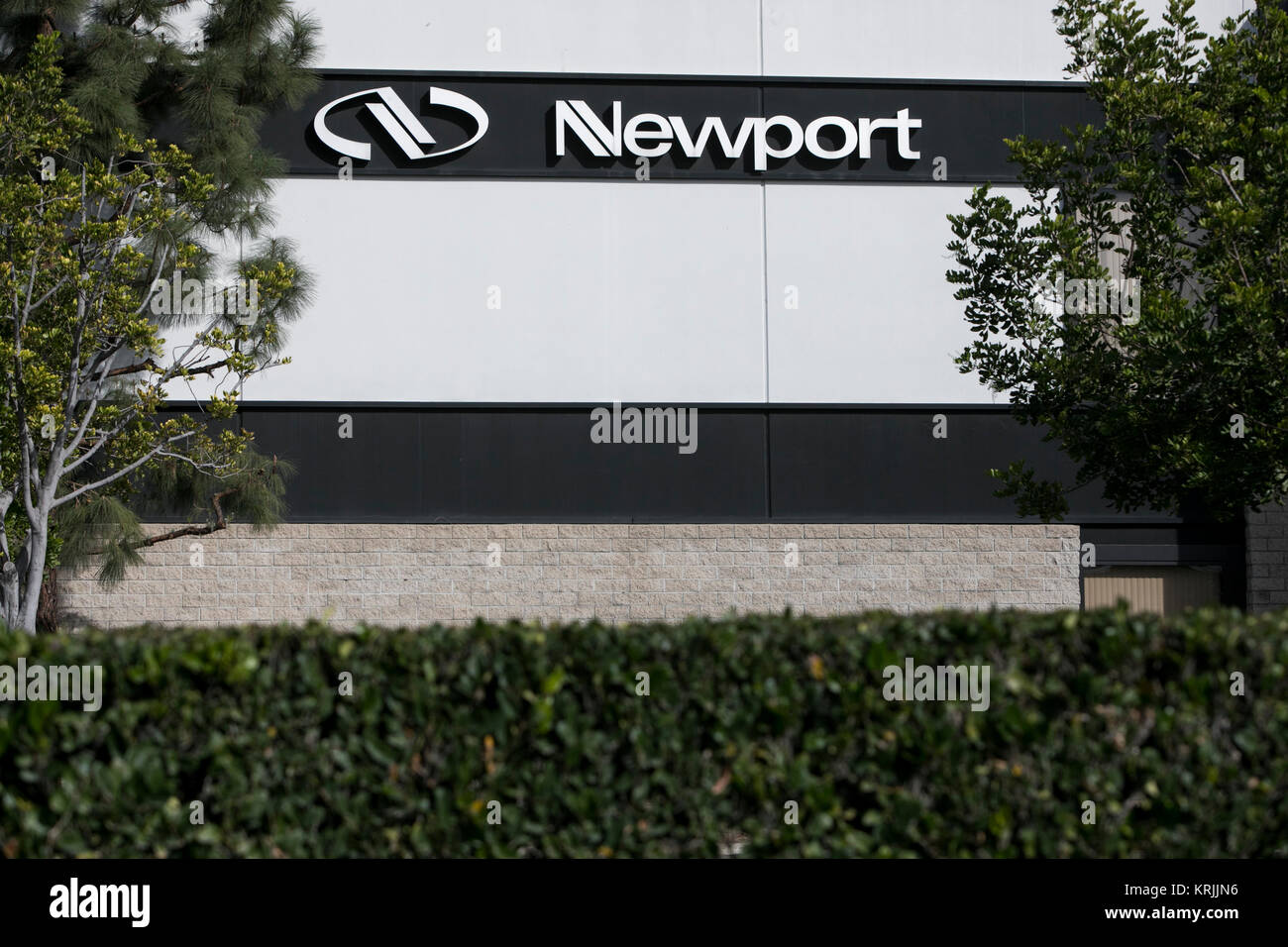 A logo sign outside of the headquarters of the Newport Corporation in ...