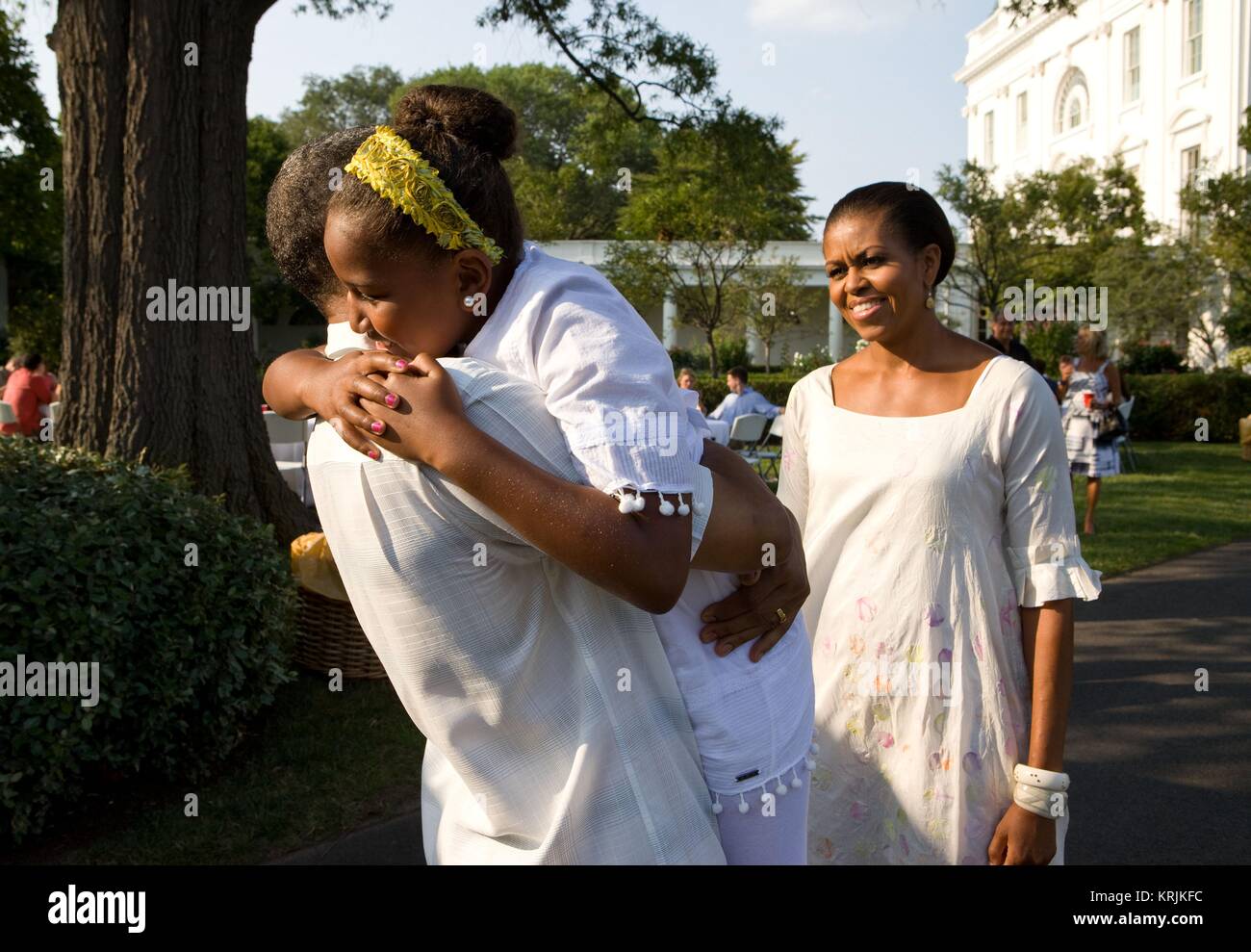 U.S. First Lady Michelle Obama watches as Sasha Obama hugs U.S ...
