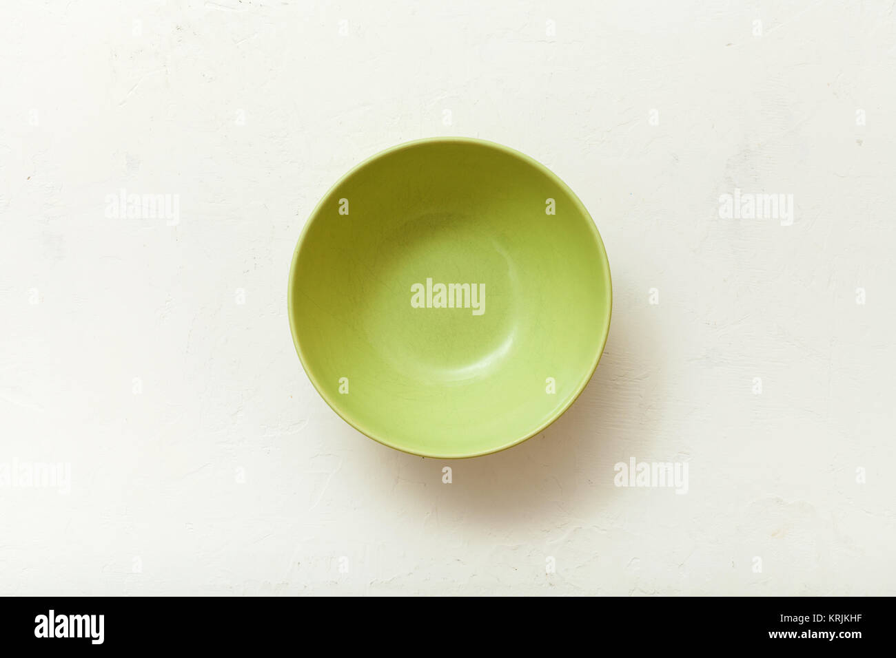 top view of green bowl on plastering plate Stock Photo - Alamy