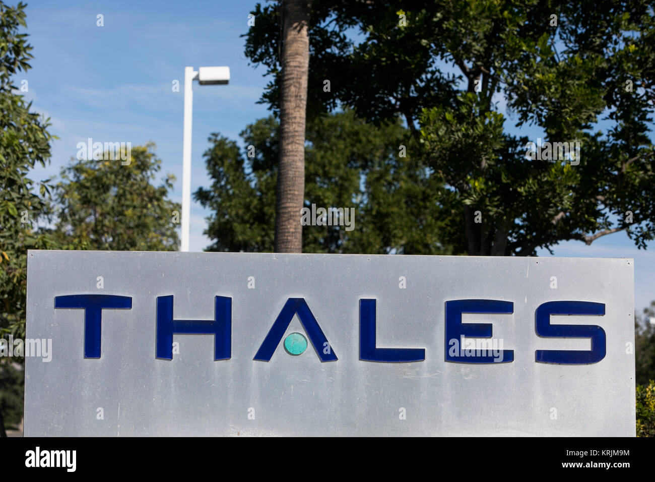 A logo sign outside of a facility occupied by the Thales Group in ...