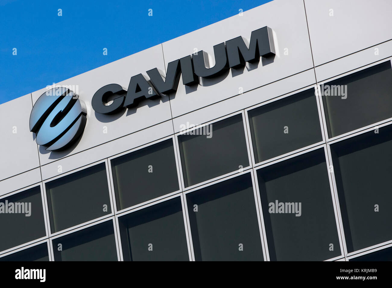 A logo sign outside of a facility occupied by Cavium in Irvine ...