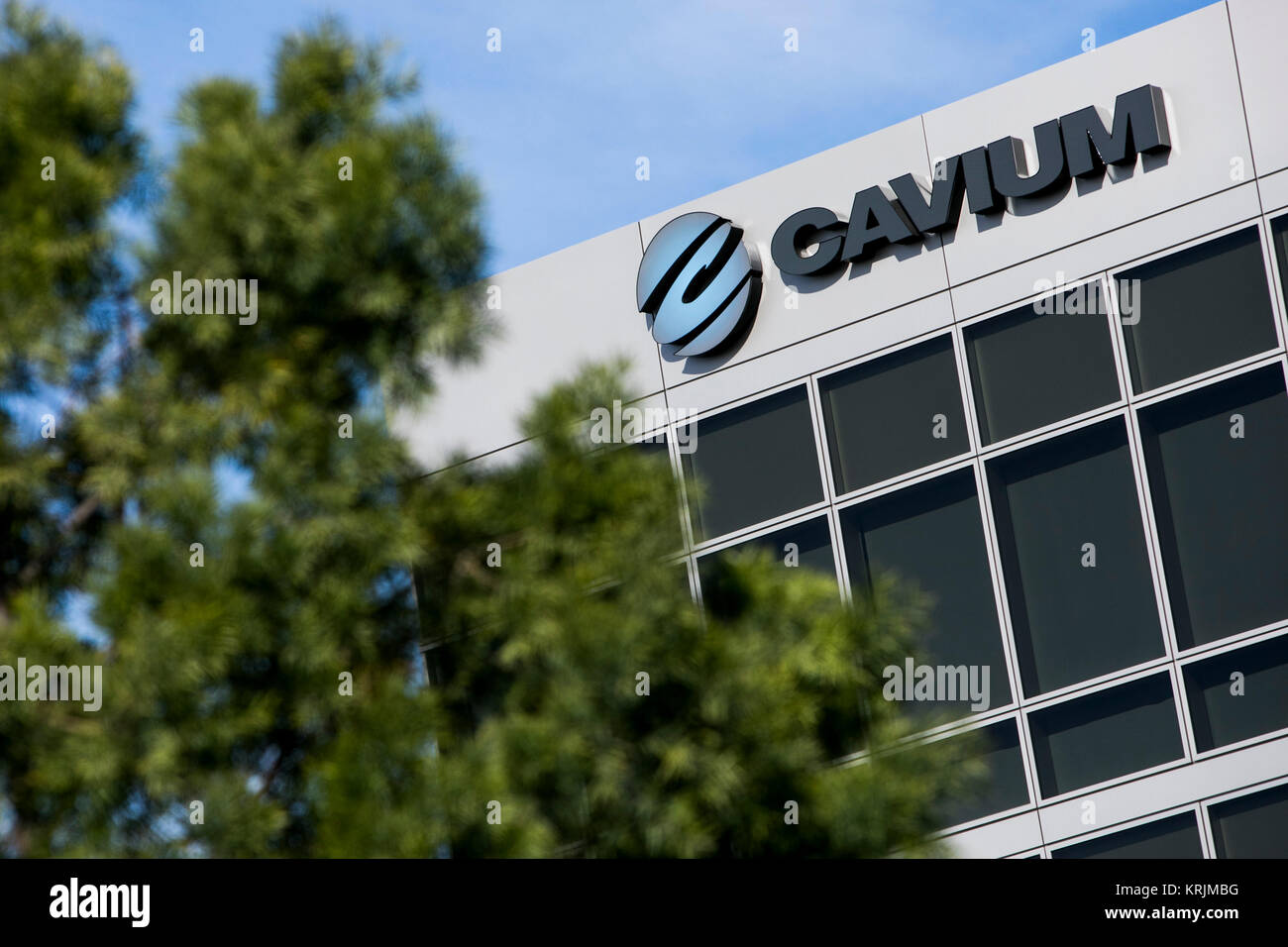 A logo sign outside of a facility occupied by Cavium in Irvine ...