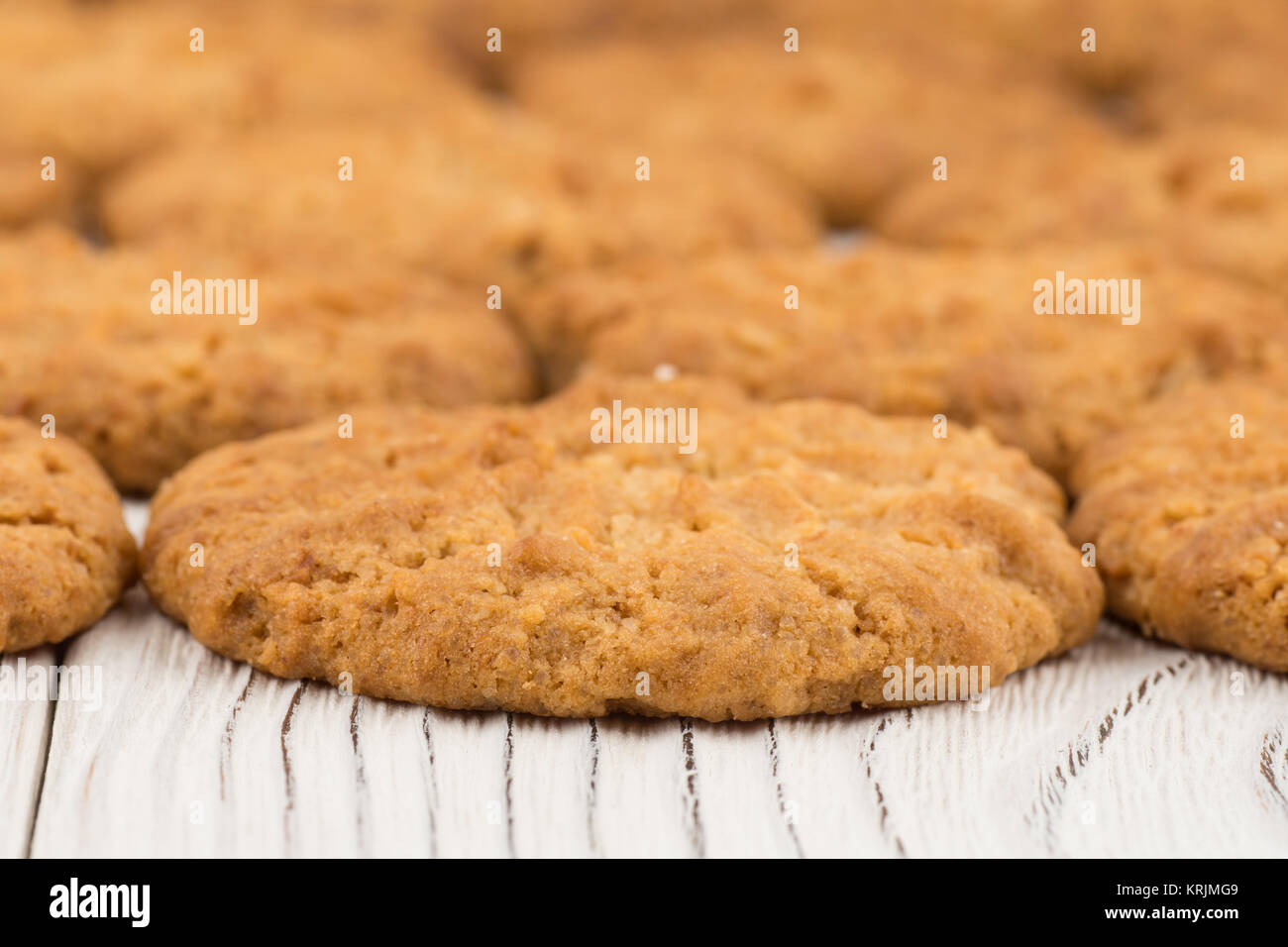 Cookie on old white wooden table Stock Photo - Alamy