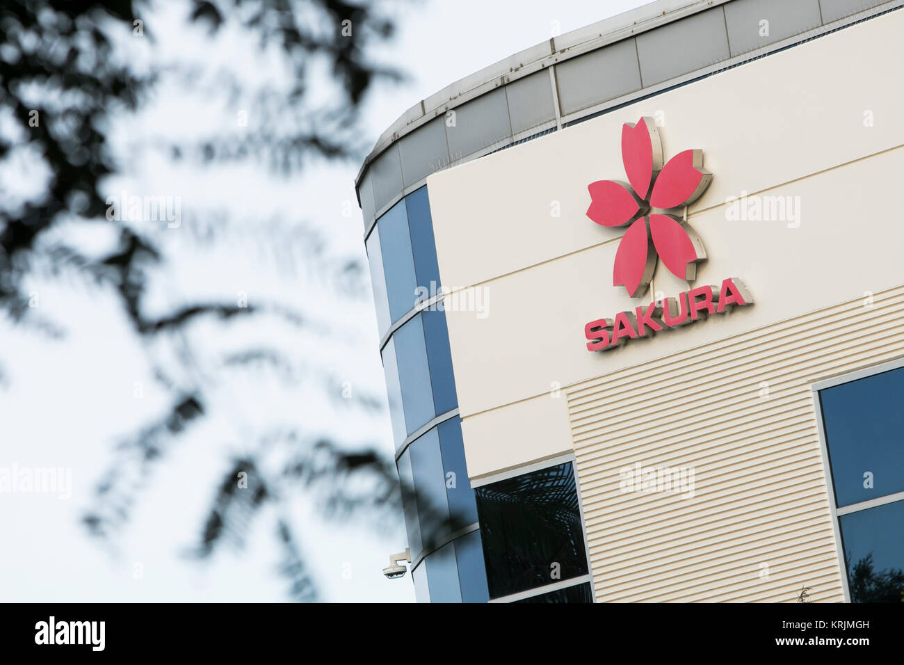 A logo sign outside of a facility occupied by Sakura Finetek in ...
