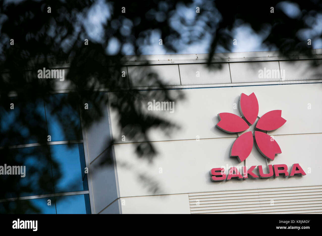 A logo sign outside of a facility occupied by Sakura Finetek in ...