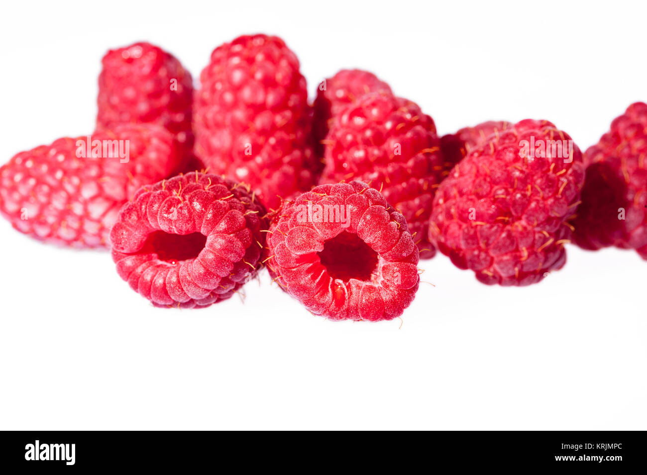 Group of red raspberries isolated on white background Stock Photo - Alamy