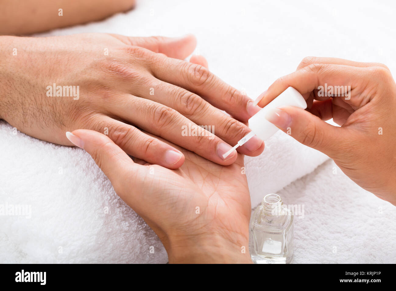 Man applying oil woman hi-res stock photography and images - Alamy