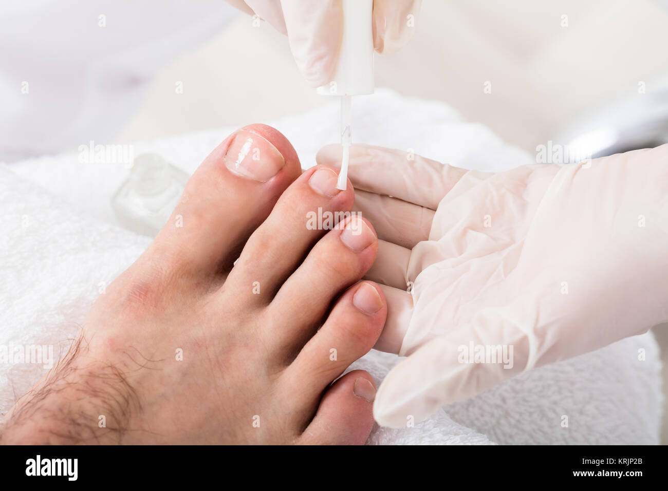 Man applying oil woman hi-res stock photography and images - Alamy