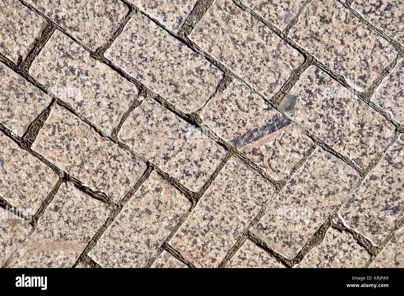 Pavement of granite tiles at an angle Stock Photo - Alamy
