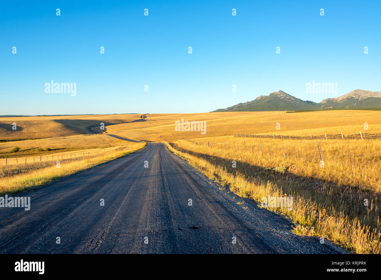 Long Road and Mountains Stock Photo - Alamy