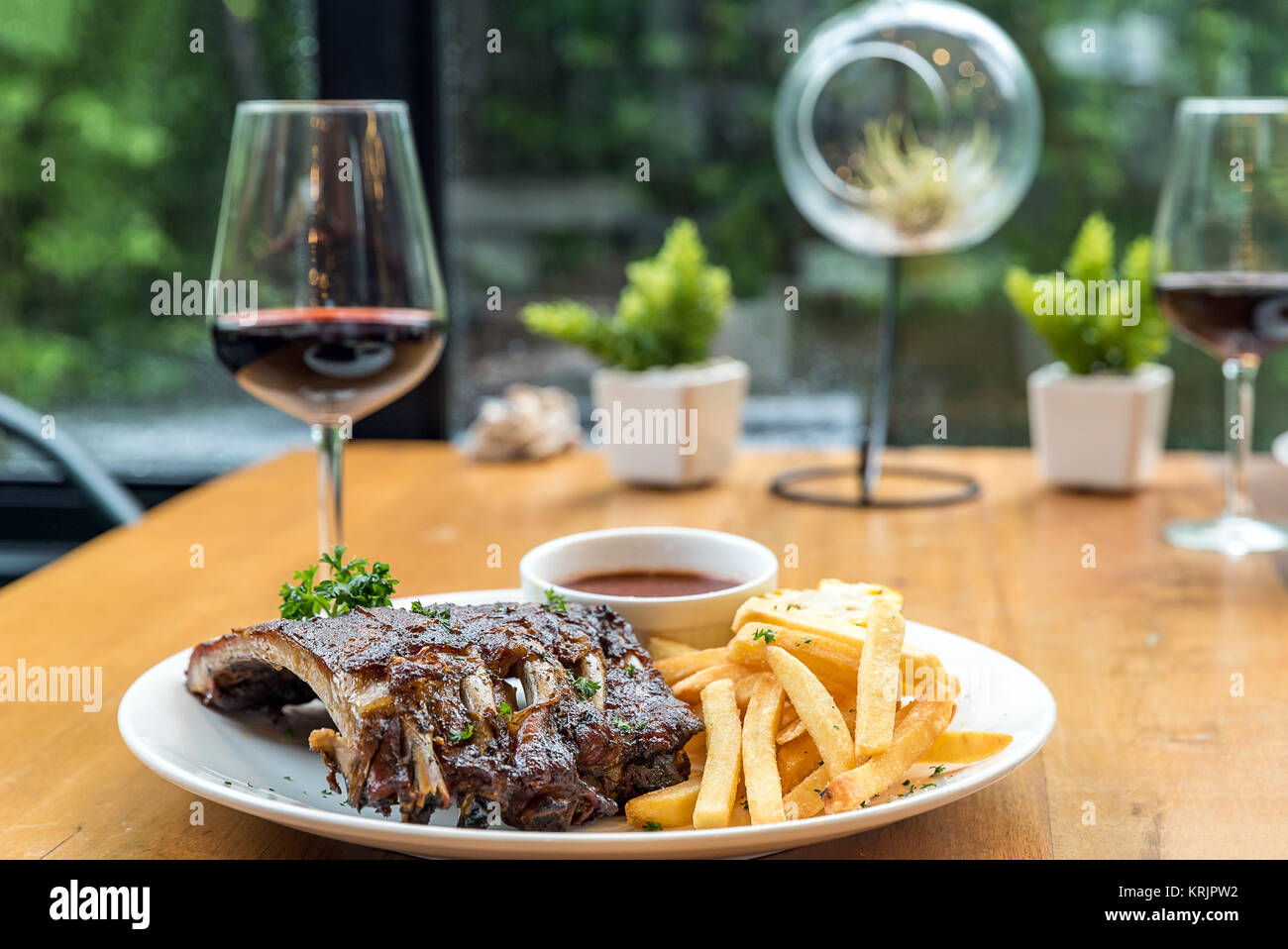 Grilled Pork rib dining table Stock Photo - Alamy