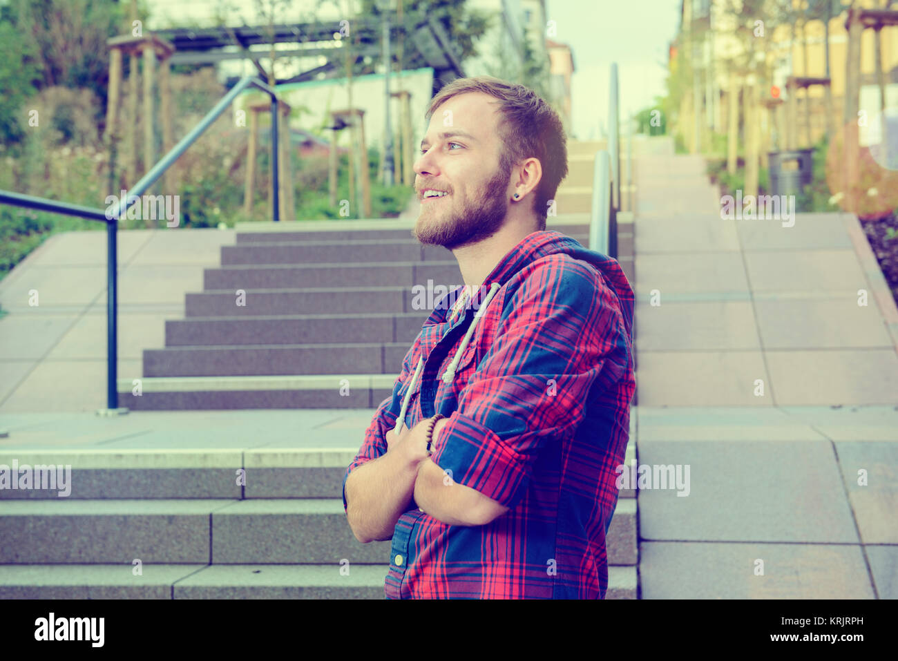 young man standing in the city on stairs Stock Photo - Alamy
