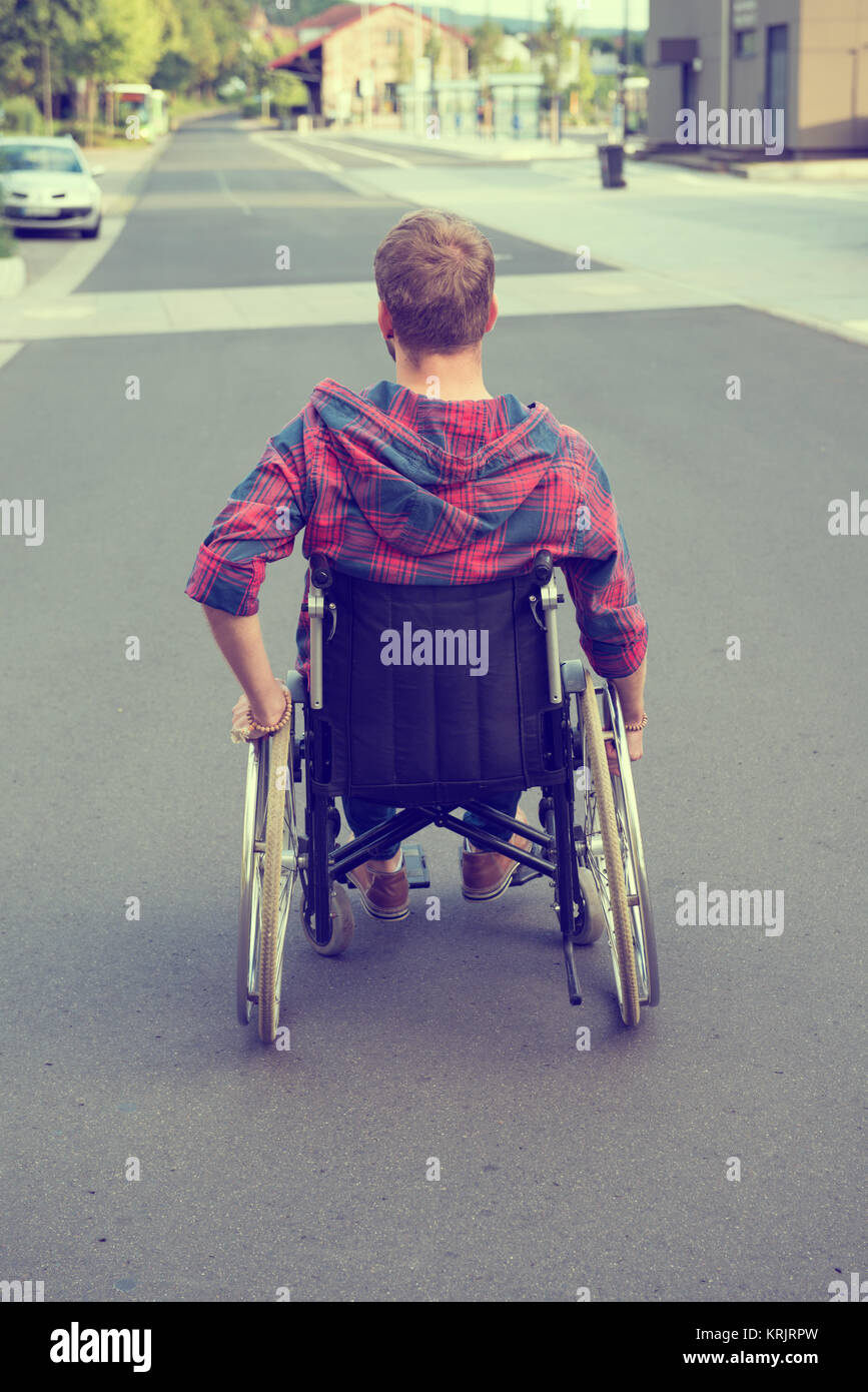 you disabled in wheelchair on road Stock Photo - Alamy