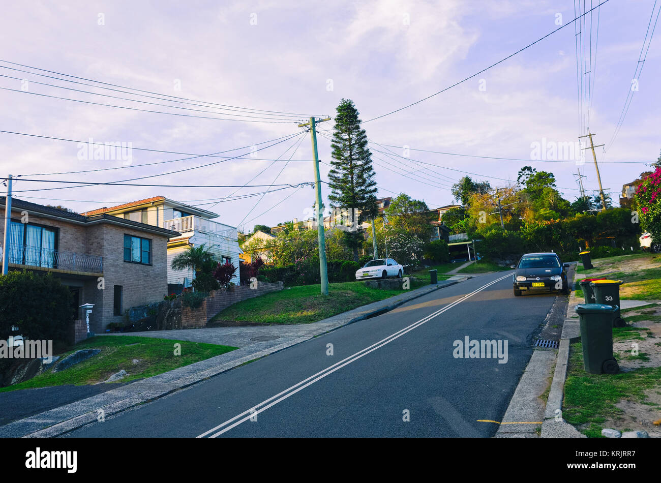 Typical suburban Australia street with sidewalk, residential buildings ...