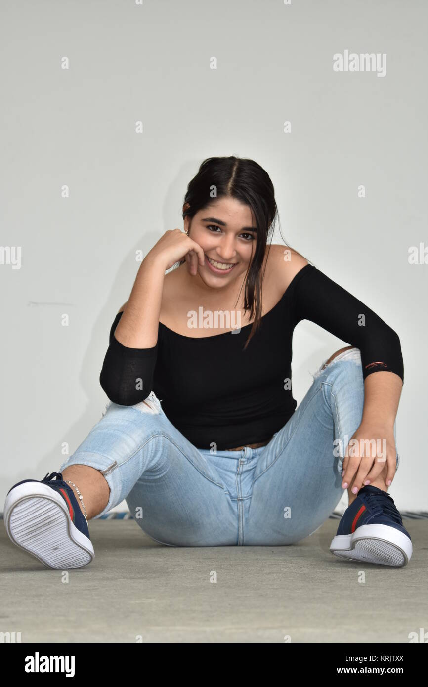 Beautiful Girl Sitting Stock Photo - Alamy