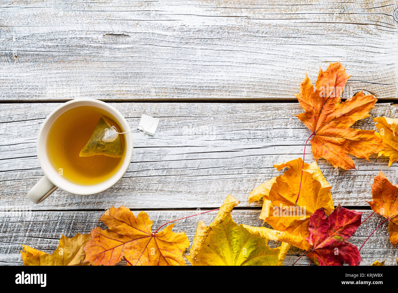 Cup of tea with autumn leaves Stock Photo - Alamy