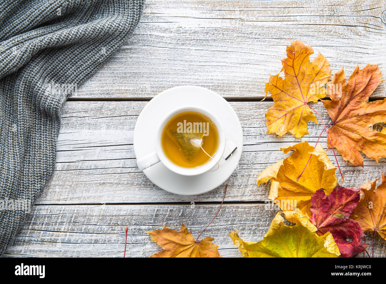 Cup of tea with autumn leaves Stock Photo - Alamy