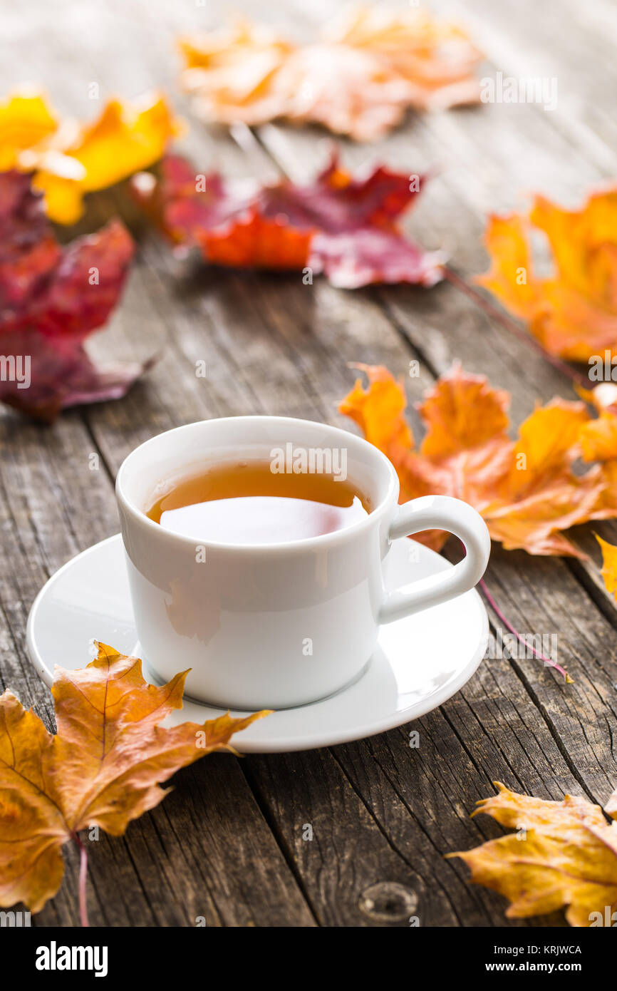 Cup of tea with autumn leaves Stock Photo - Alamy