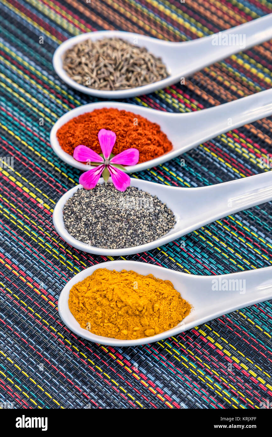 Organic cooking spices served in spoons Stock Photo - Alamy