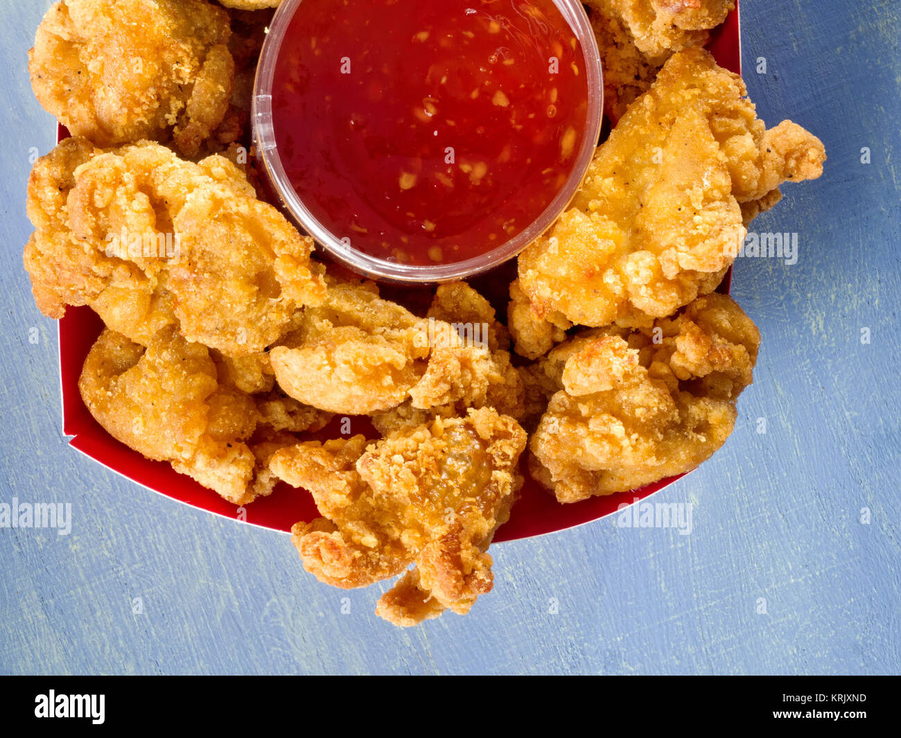 rustic golden fried popcorn chicken nugget Stock Photo - Alamy