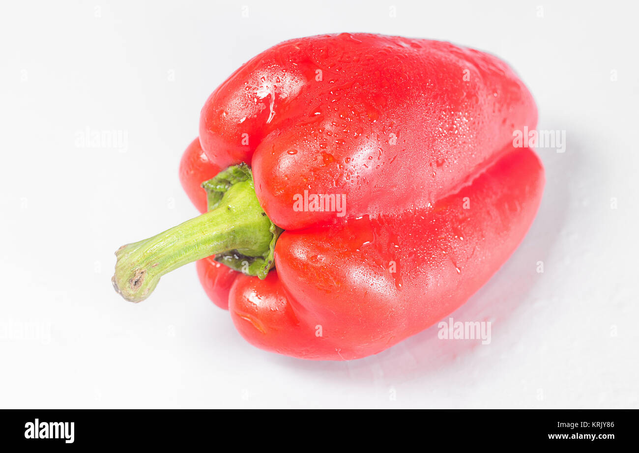 A whole pepper and pepper slices Stock Photo - Alamy