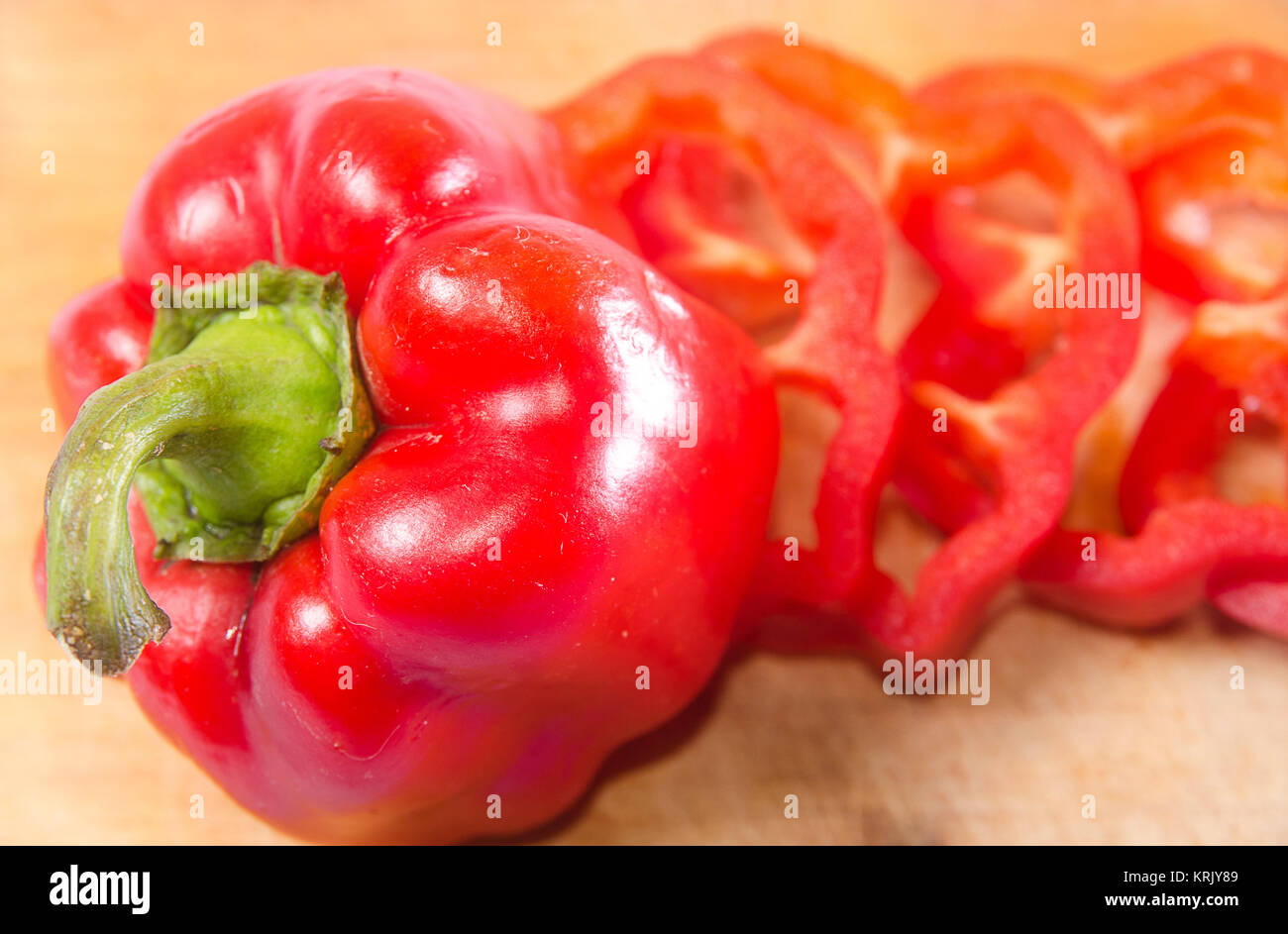 A whole pepper and pepper slices Stock Photo - Alamy