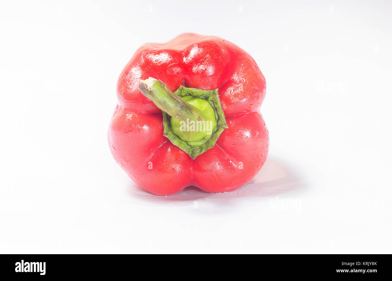 A whole pepper and pepper slices Stock Photo - Alamy