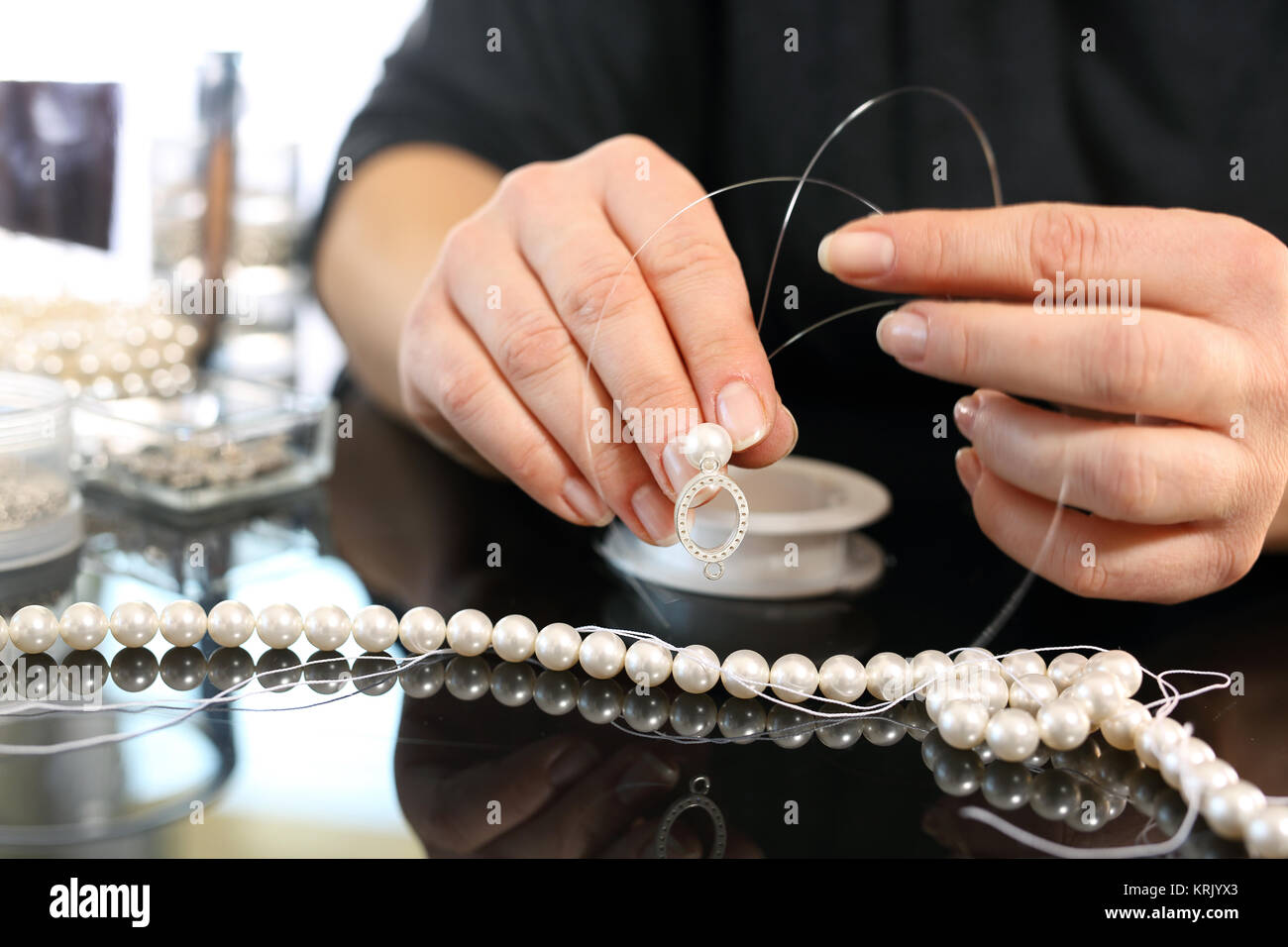 female threaded pearl necklaces Stock Photo - Alamy