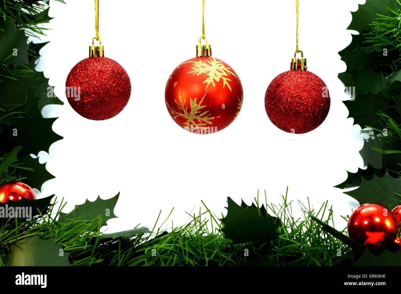Three Christmas baubles suspended Stock Photo - Alamy