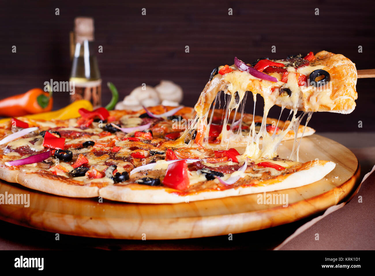 Pizza Slice lift Stock Photo - Alamy
