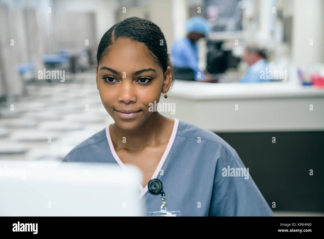 Nurse using computer Stock Photo - Alamy