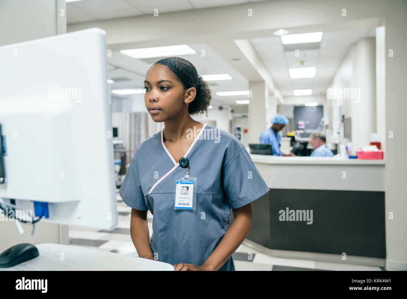 Nurse using a computer Stock Photo - Alamy