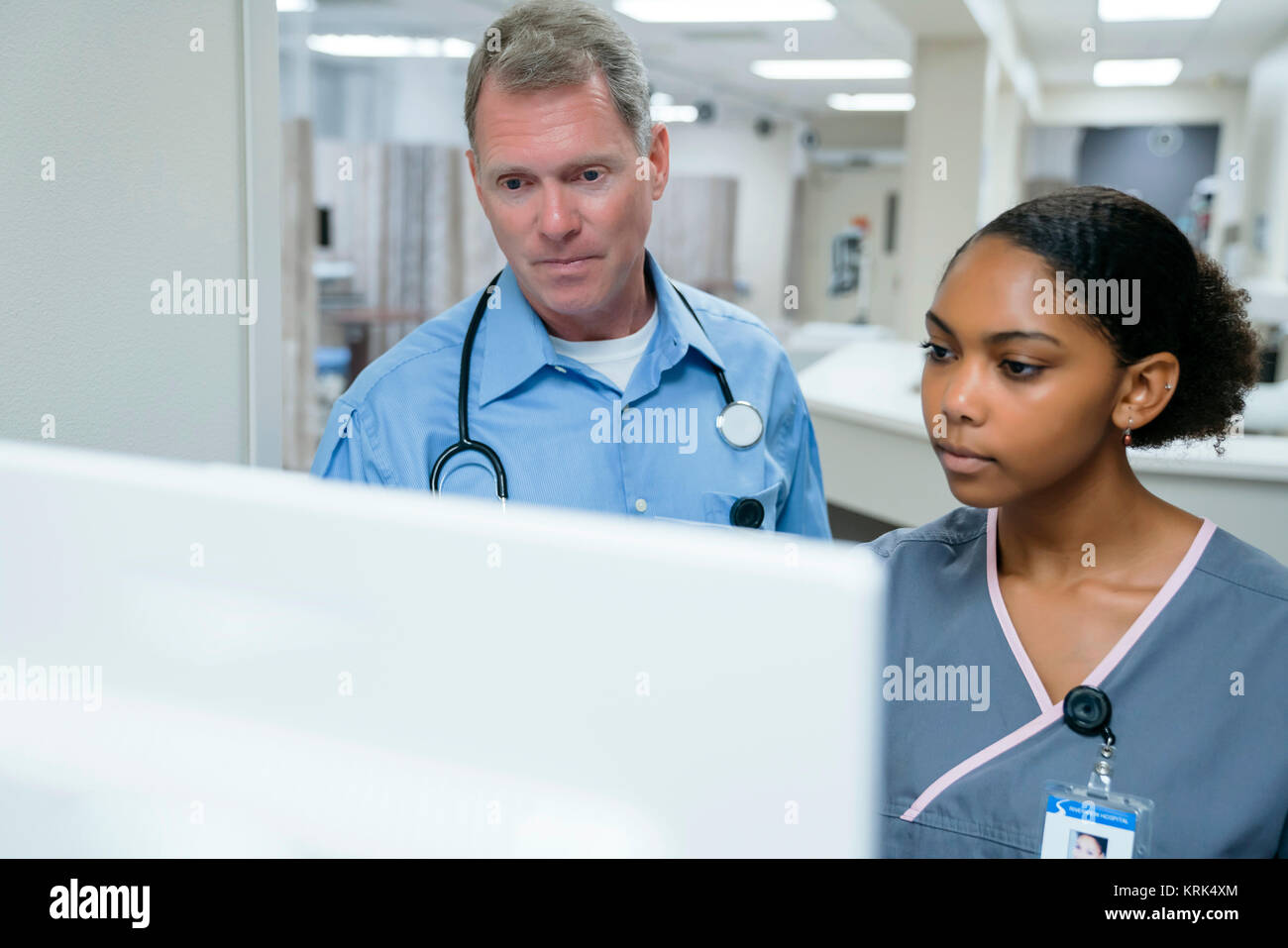 Doctor and nurse using computer Stock Photo - Alamy