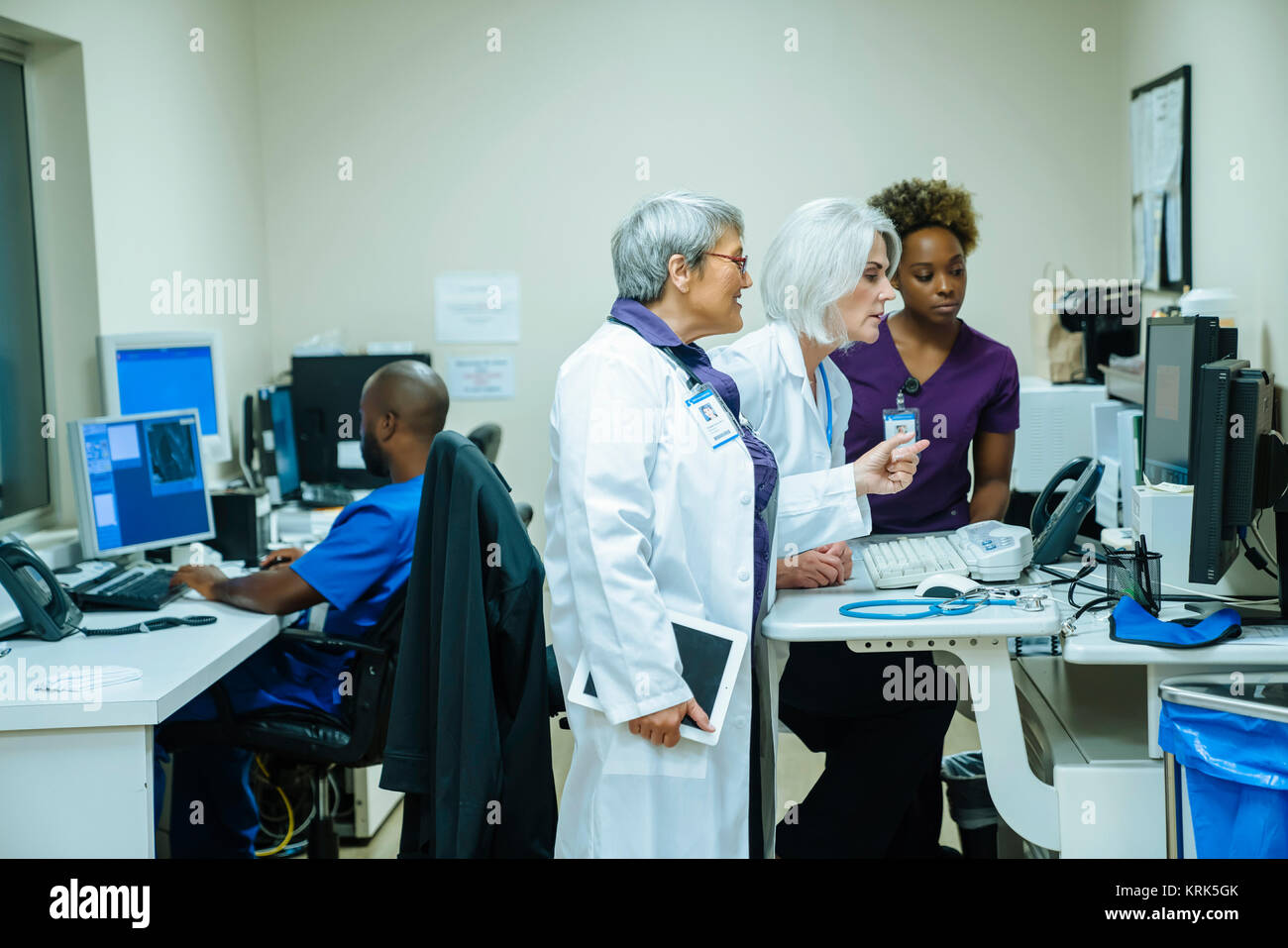 Doctors and nurses using computers Stock Photo - Alamy